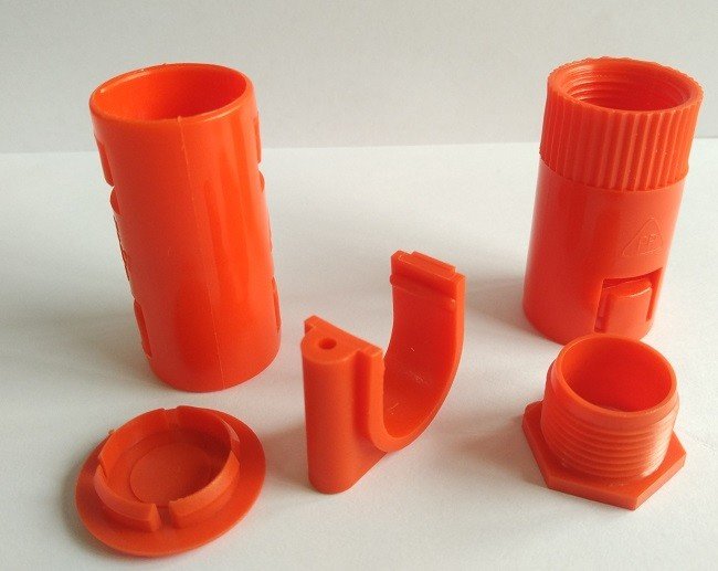 Orange ABS Plastic Injection Molded Parts Multi Cavity For Vending Machine
